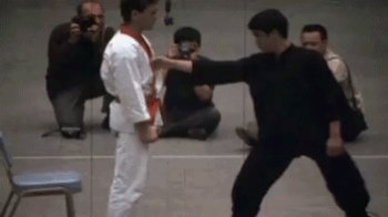 Bruce Lee in Action: Dynamic Animated GIF of Martial Arts Mastery